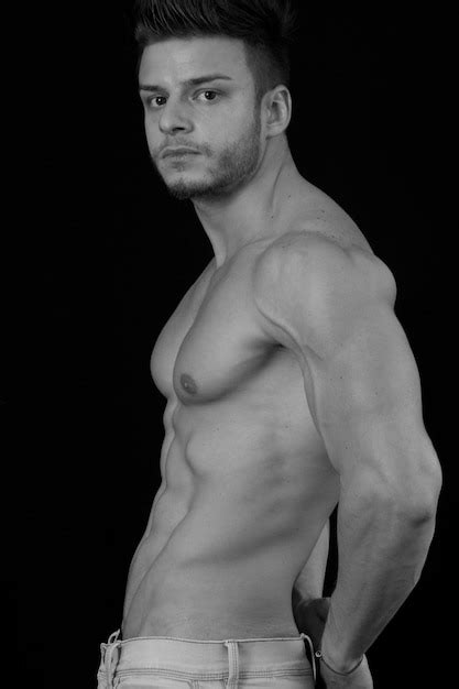 Premium Photo Portrait Of Shirtless Muscular Man Standing Against