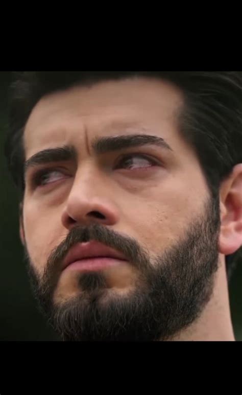 A Close Up Of A Man With A Beard