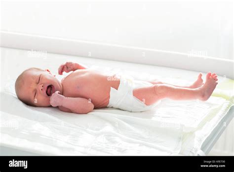 Cute Newborn Baby Crying On The Bed Stock Photo Alamy
