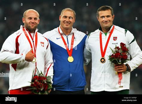 Silver Medalist Piotr Malachowski Of Poland L R Gold Medalist Gerd