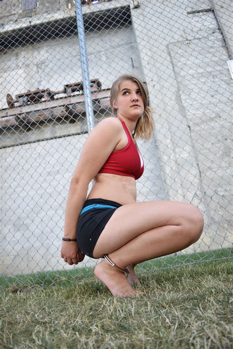 Woman Hands Cuffed Behind Back And Let Ironed Barefoot She Fully Agreed Stretches In The Backyard