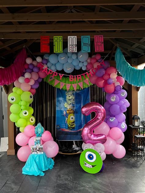 Balloons And Streamers In The Shape Of Numbers Are On Display