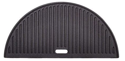 A Black Grill Grate With No Handles On The Top And Bottom In Front Of A