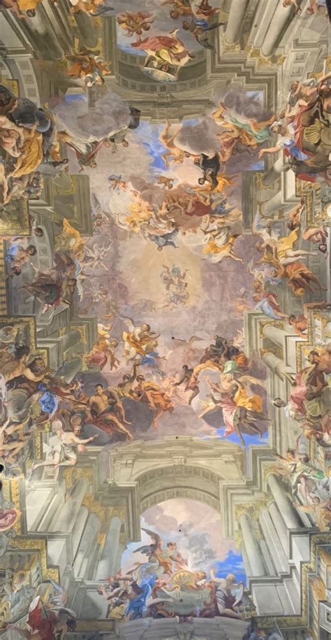 An Ornate Ceiling With Many Paintings On It