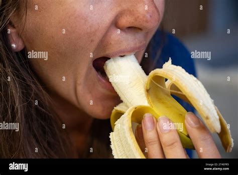 Woman Eats Food Woman Eats Banana Close Shot Of Girl Eating Bananas Face While Eating Banana