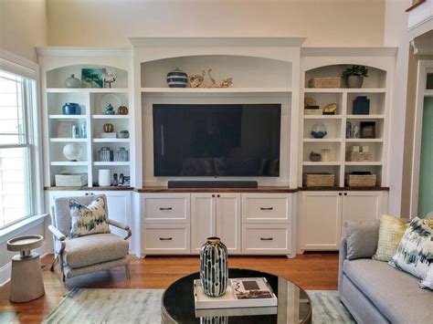 A Living Room Filled With Furniture And A Flat Screen Tv