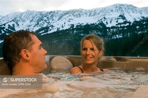 Mature Couple Relaxing In A Hot Tub SuperStock