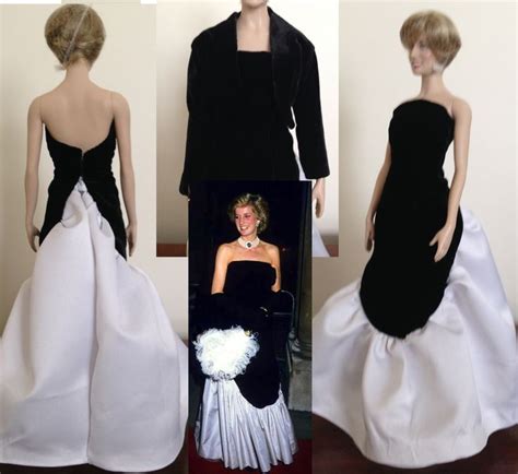 A Woman In A Black And White Dress Is Shown