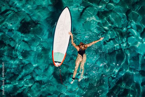 Surf Woman Float With Surfboard In Turquoise Ocean Aerial View Stock