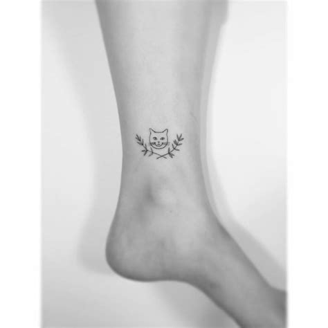 Cat Portrait And Laurel Wreath Tattoo Located On The