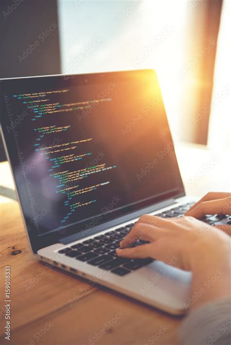 closeup coding on screen woman hands coding html and programming on screen laptop development
