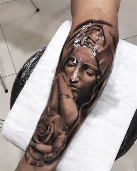 A Man S Arm With A Tattoo On It That Has A Woman Holding A Rose