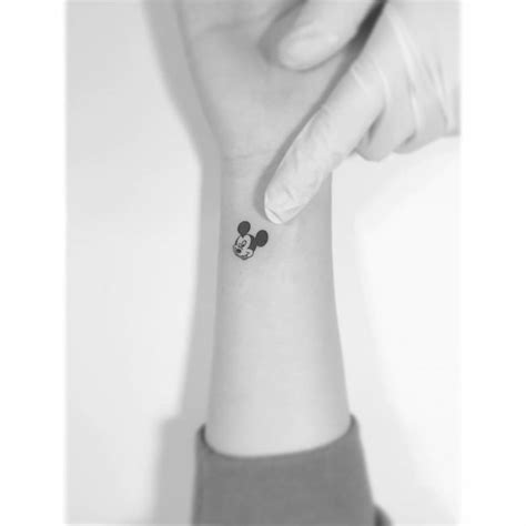 Tiny Mickey Mouse Portrait Tattoo Located On The Wrist