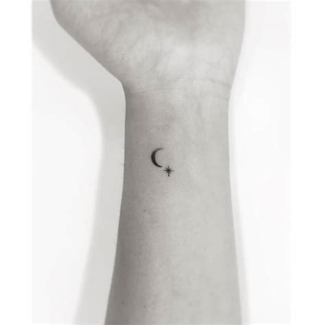 Moon And Star Tattoo Located On The Wrist Minimalistic
