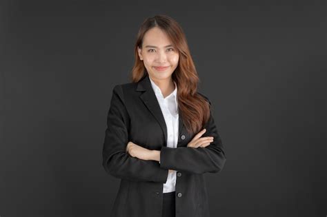 Premium Photo Business Woman Wearing A Black Suit Standing With Arms