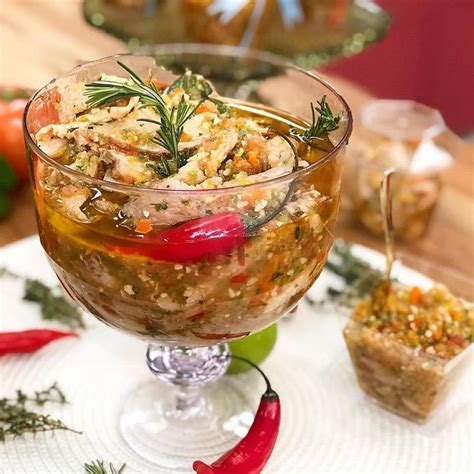 A Glass Bowl Filled With Food Sitting On Top Of A Table Next To Other Foods