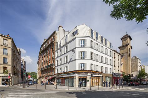 Restructuration et surélévation d un immeuble de logements sociaux