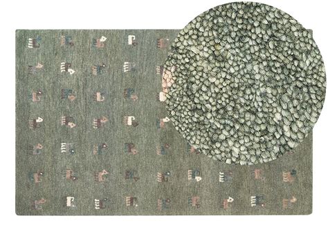 Dywan wełniany ze wzorem w zwierzęta 140 x 200 cm zielony KIZARLI