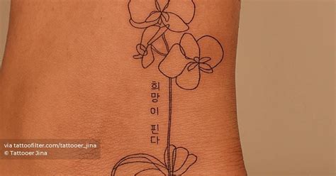 One Line Orchids Tattoo Located On The Ankle