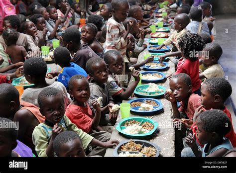 Feeding For Orphans In A Center Run By The Catholic Church Township