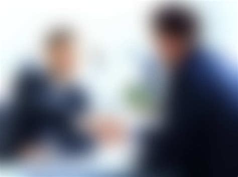 Two business colleagues shaking hands during meeting Catálogo