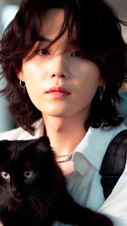 A Woman Holding A Black Cat In Her Arms