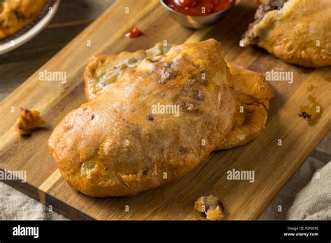 Homemade Upper MIchigan Pasty Meat Pie With Ketchup Stock Photo Alamy