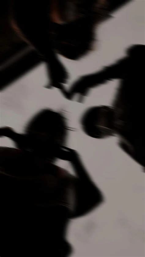 Blurry Image Of People Walking Down The Street