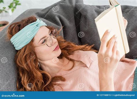 Beautiful Young Woman Reading Book While Relaxing On Couch Stock Image Image Of Reading Read