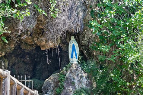 Image Of The Virgin In Her Invocation Of Our Lady Of Lourdes In A Cave