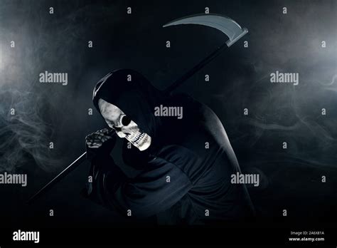 Scary Looking Grim Reaper Ghost Wielding A Scythe Or Sickle Coming Out