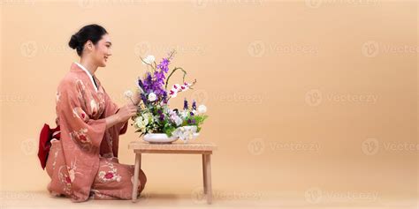 Young 20s Asian Japanese Woman Wear Traditional Kimono Does Ikebana Flower Arrangement 11029665