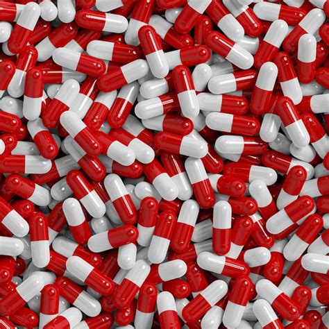 Una pila de pastillas rojas y blancas que están todas agrupadas juntos