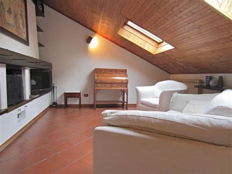 A Living Room Filled With Furniture And A Flat Screen Tv