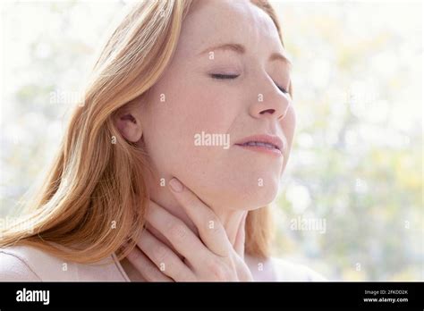 Woman With Sore Throat Stock Photo Alamy
