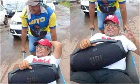Bolsonarista cumpre aposta e carrega amigo lulista em carrinho de mão