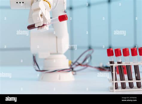 Robot Arm With Test Tube For Biological Experiments In Laboratory Stock