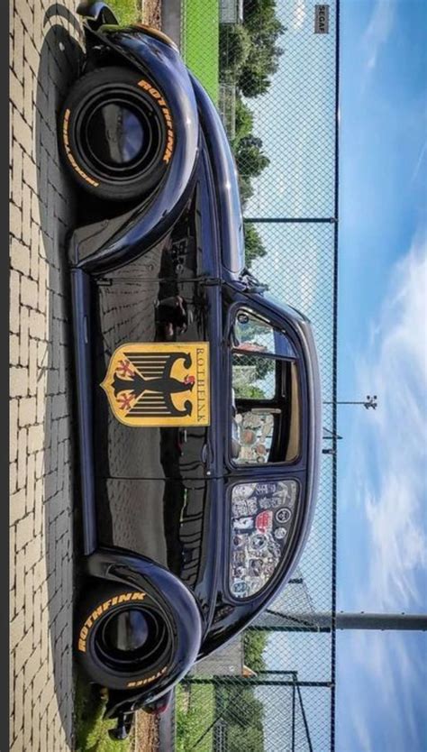 The Rear End Of A Black Car With Speakers On It S Roof And Side View Mirror