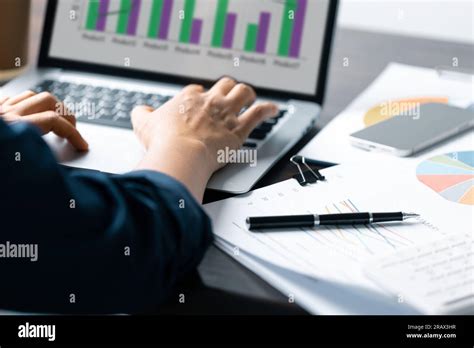 Business Data Analysis On Laptop Financial Charts Graphs Reports For