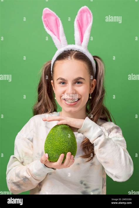 Happy Easter Cheerful Girl With Easter Bunny Ears And Big Easter Egg