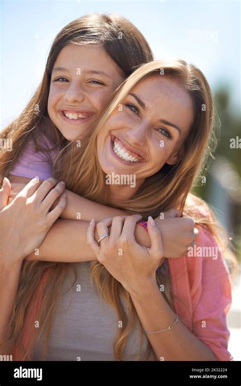 Happy Holiday Moment Portrait Of A Loving Mother And Daughter Standing