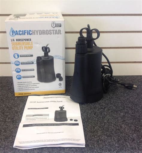 A Black Water Pump Sitting On Top Of A Counter Next To A Box With