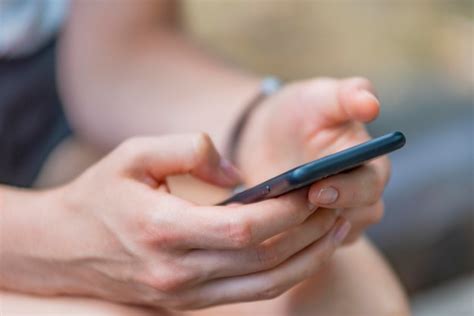 Premium Photo Close Up Of Women S Hands Holding Cell Telephone