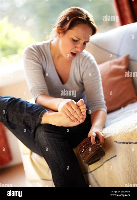 Woman Massaging Foot Stock Photo Alamy