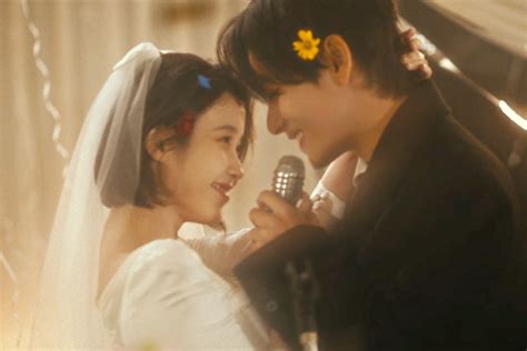 Watch IU And BTS S V Tell A Heartbreaking Love Story In Cinematic MV