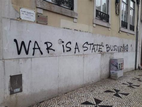 Radical Graffiti On Twitter War Is A State Business Seen In Lisbon