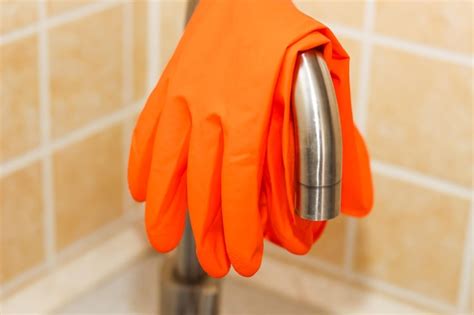 Premium Photo Kitchen Sink With Faucet And Gloves For Cleaning