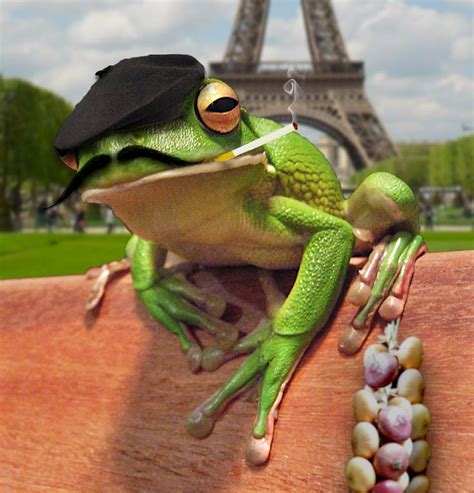 A Green Frog Sitting On Top Of A Wooden Table