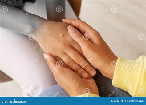 Empathy Women Holding Hands Indoors Closeup Transition From Black