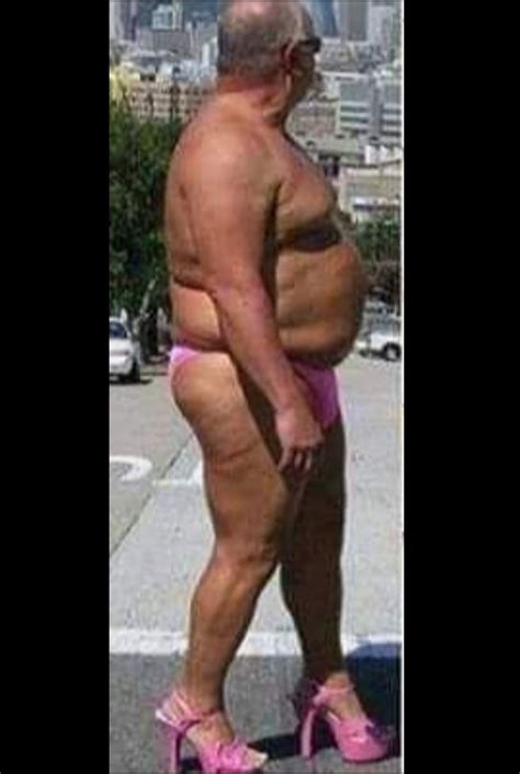 An Older Woman In Pink Panties Standing On The Sidewalk